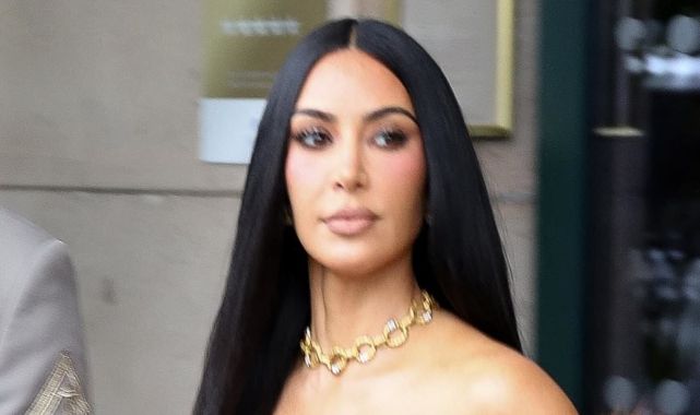 Kim Kardashian puts on a busty display as she steps out in Paris ...